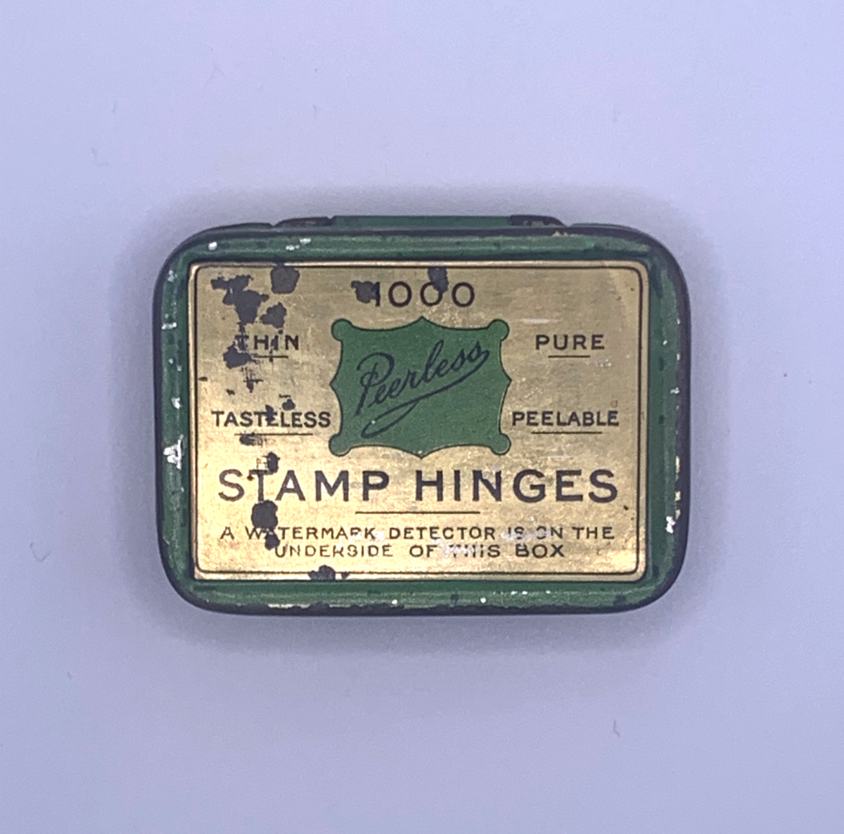 Peerless vintage stamp hinge tin for "tasteless stamp mounts" (65146)